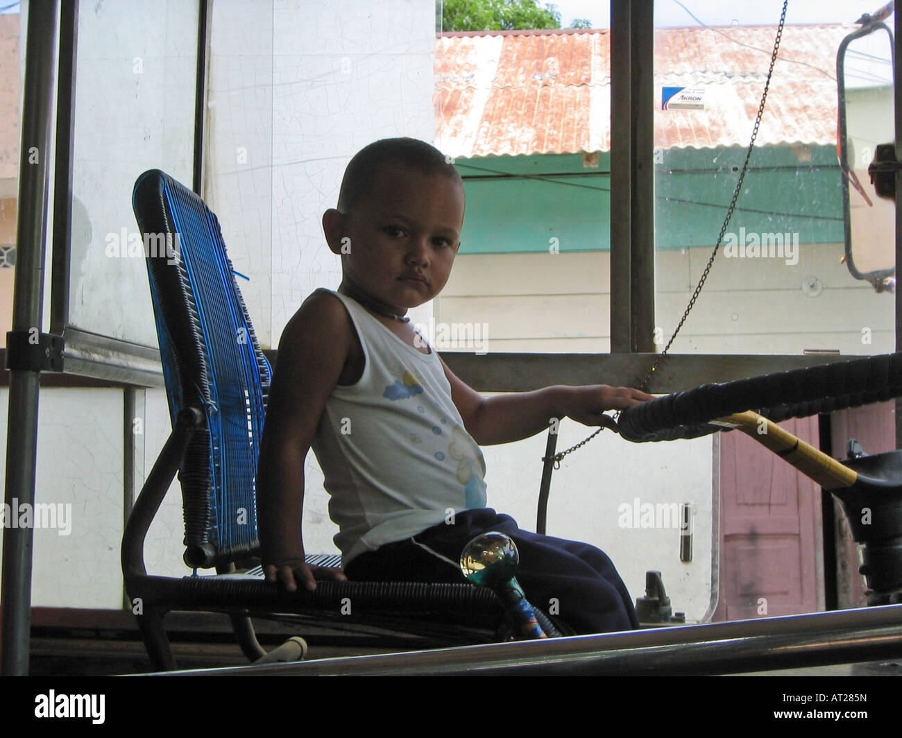 little boy driving a bus Stock Photo - Alamy