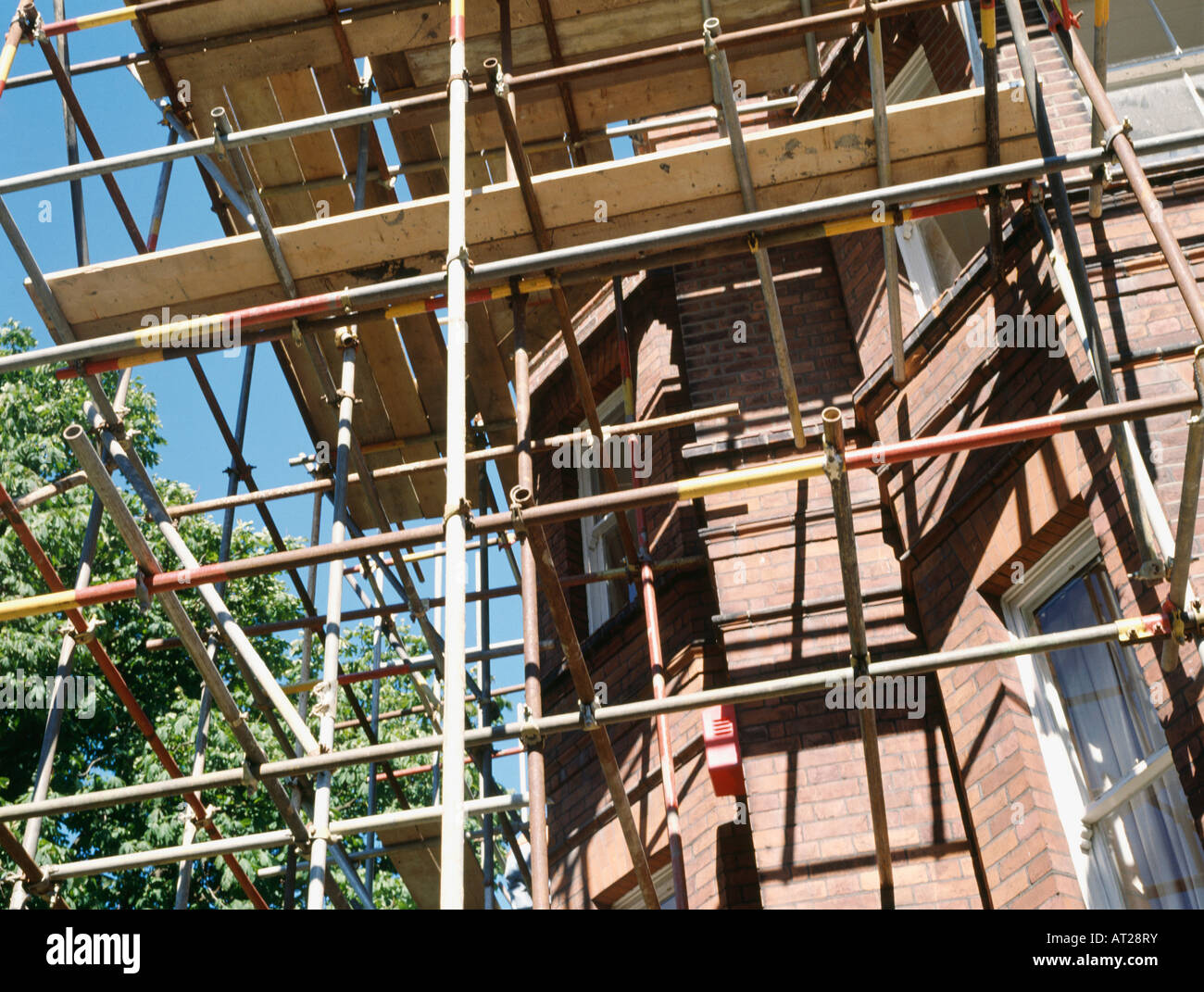 Scaffolding on exterior of traditional house Stock Photo - Alamy