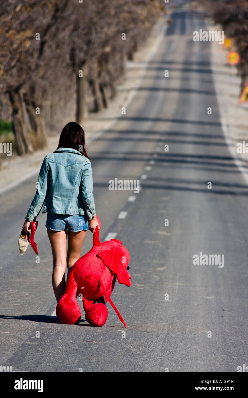 Young woman left behind with her teddy bear Stock Photo - Alamy
