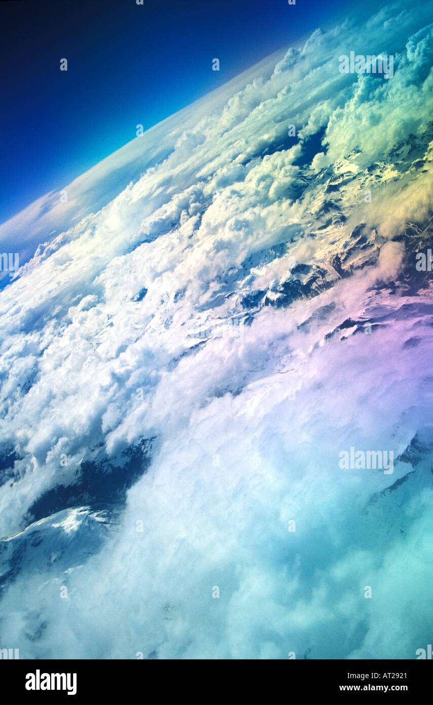 Aircraft window view of sun and clouds over Swiss Alps Switzerland ...