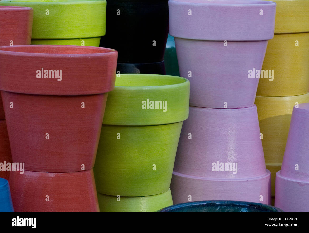 Colourful garden pots on display at a garden centre in England Stock ...