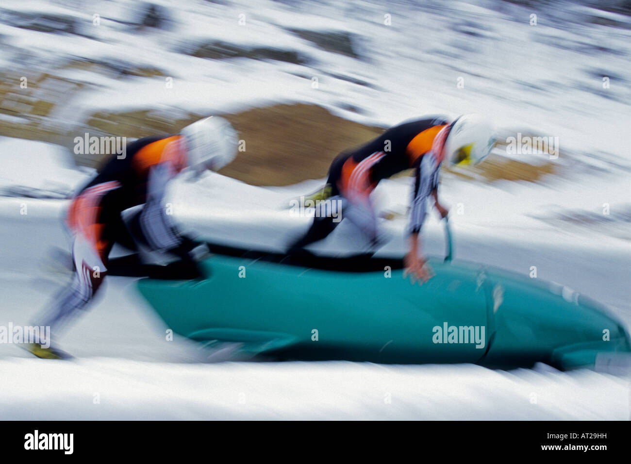 Two man bobsled team pushing off at the start Stock Photo - Alamy