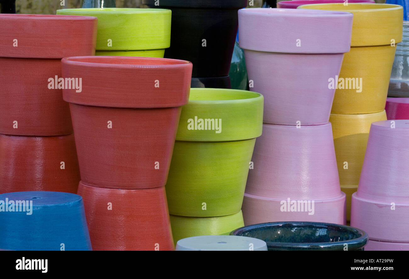 Colourful garden pots on display at a garden centre in England Stock ...