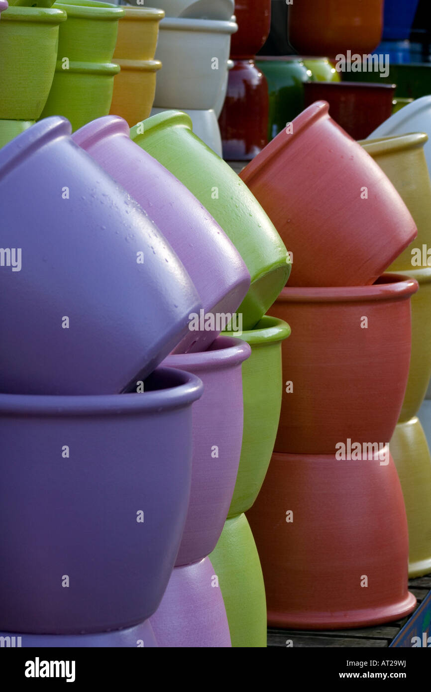 Colourful garden pots on display at a garden centre in England Stock ...