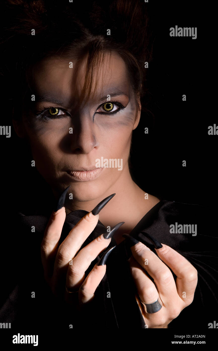 beautiful woman with scary claws and wolf eyes Stock Photo - Alamy