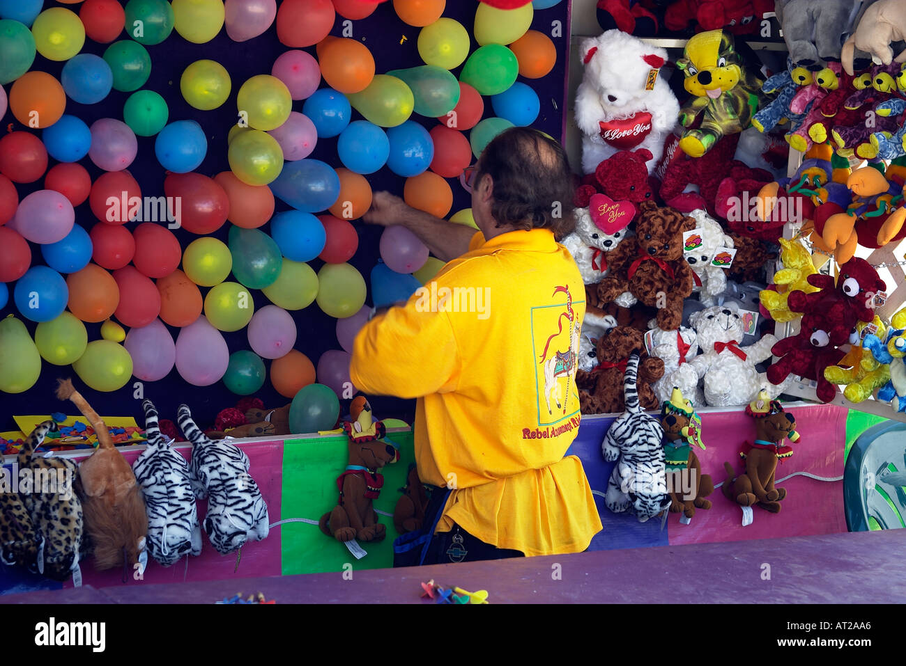 Carnival booth worker hi-res stock photography and images - Alamy