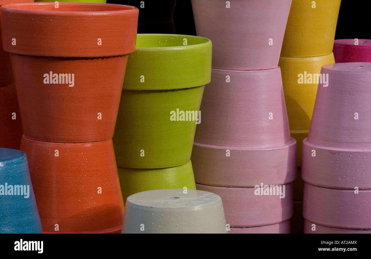Colourful garden pots on display at a garden centre in England Stock ...
