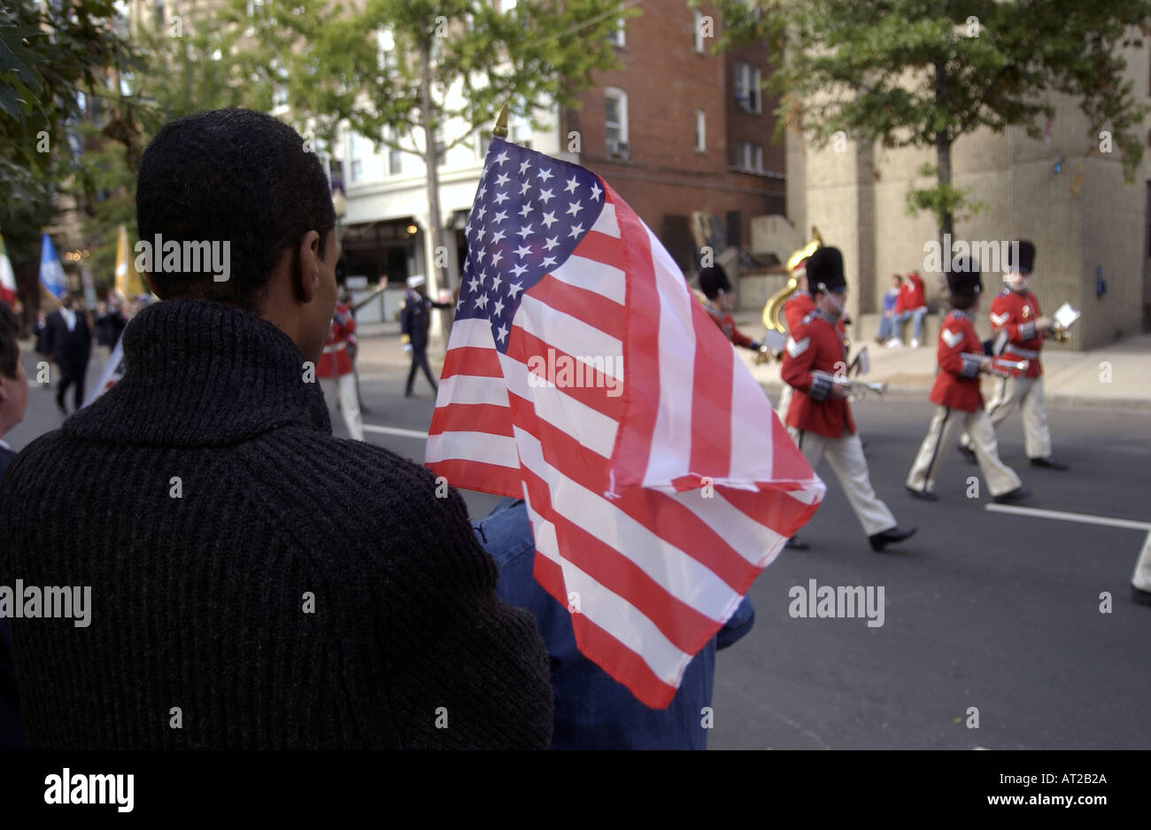 Man watching parade holding american flag Stock Photo - Alamy