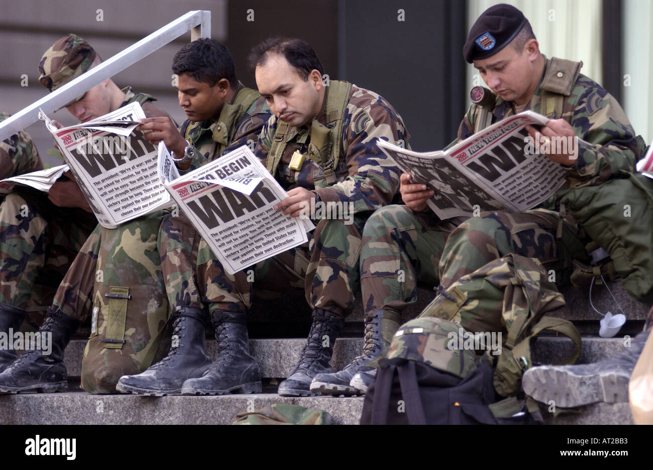 US Soldiers reading newspaper headline of WAR three days after 9 11 at ...