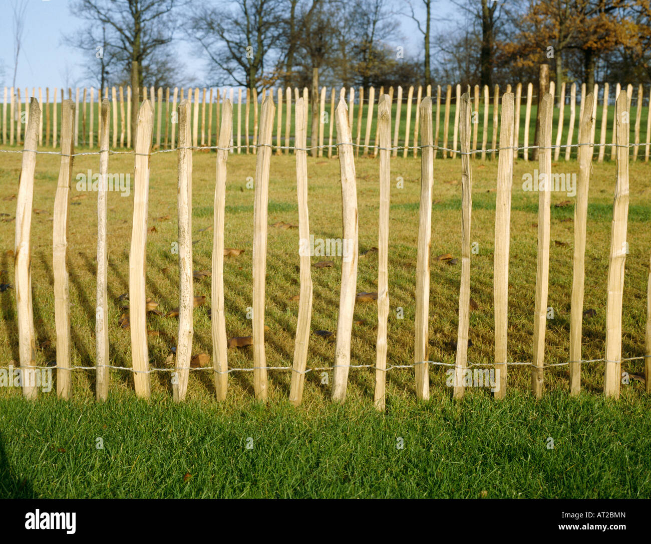 Wooden stake fence on perimeter of new garden before planting Stock ...