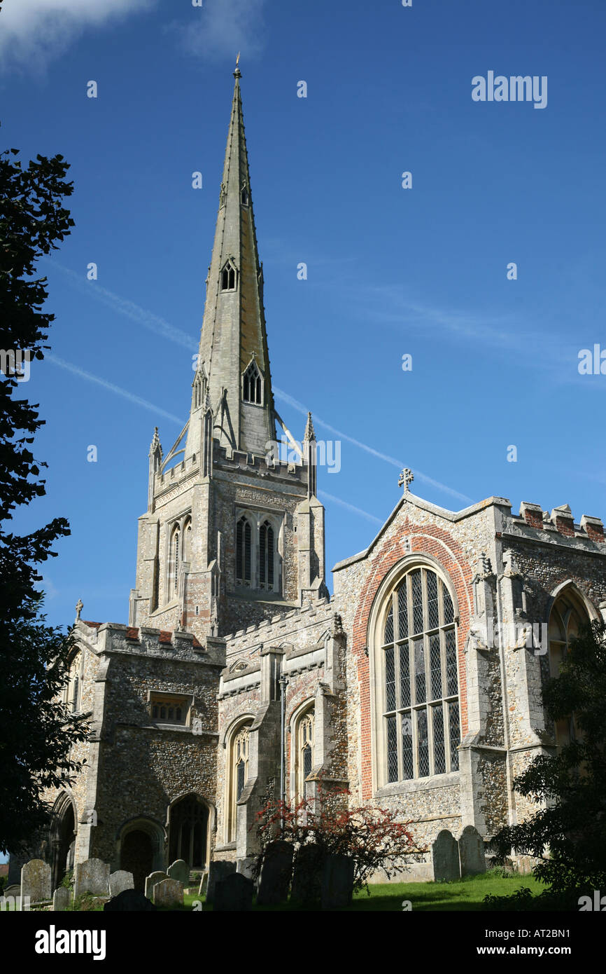 Thaxted Parish Church in Thaxted Essex with a bright blue sky and some ...
