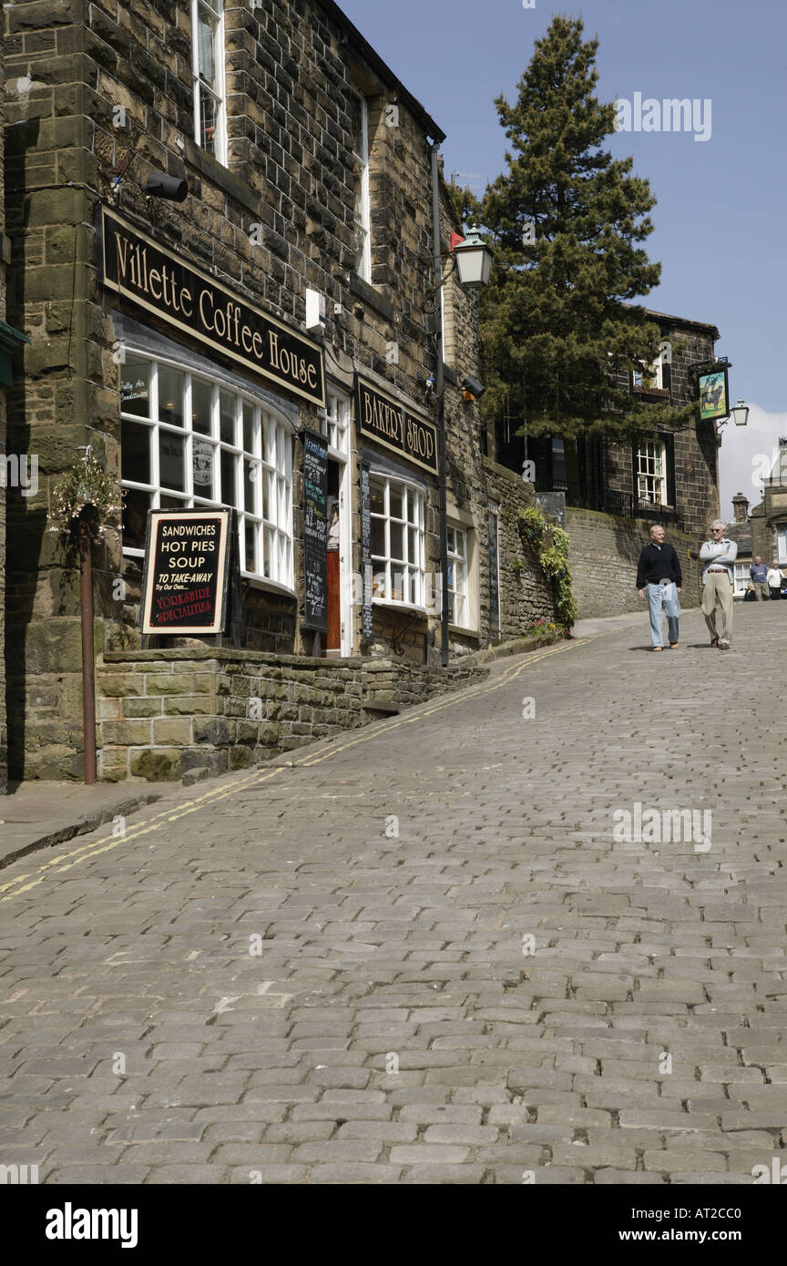 STEEP COBBLED MAIN STREET AND BLACK BULL PUB HAWORTH VILLAGE YORKSHIRE ...