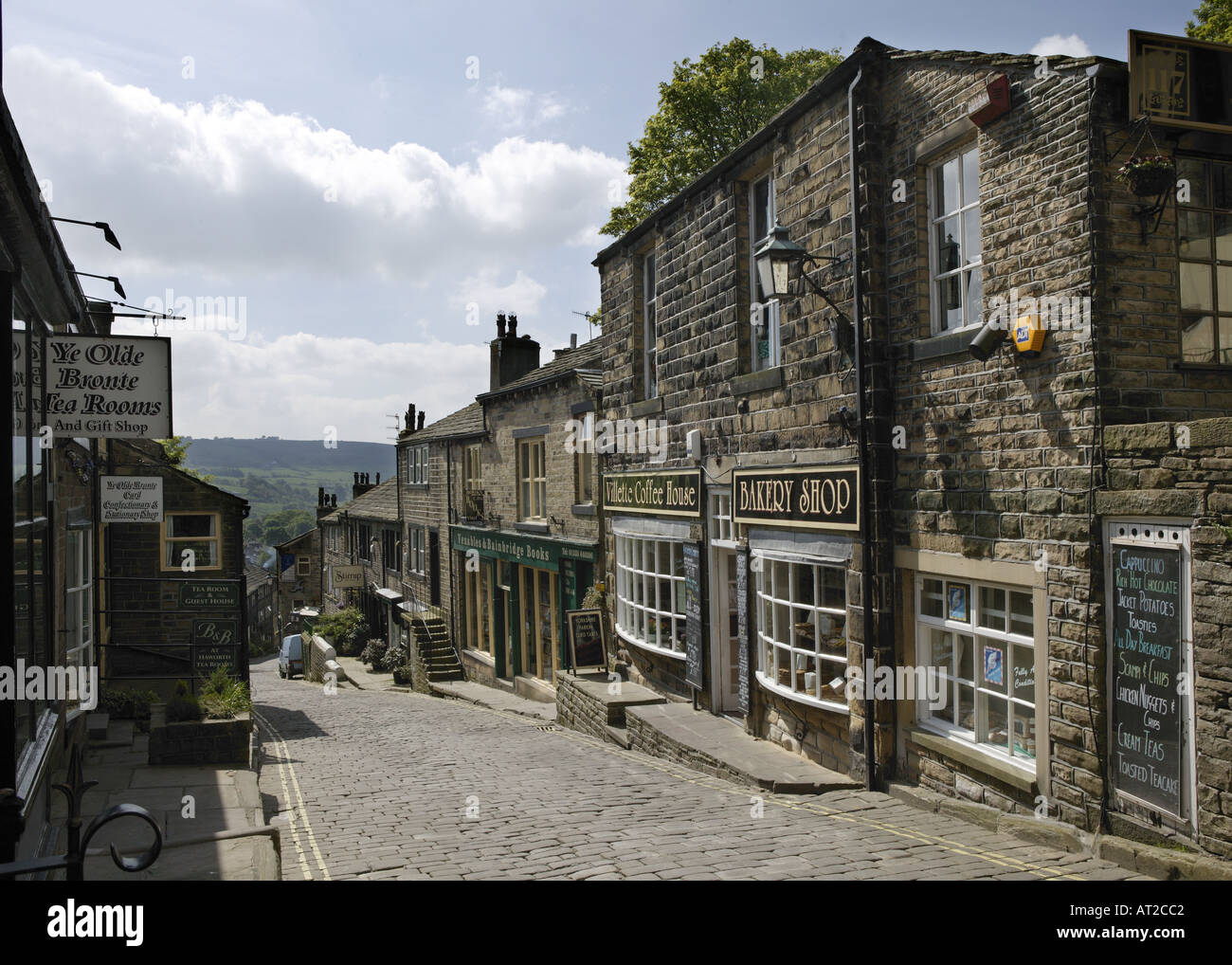 STEEP COBBLED MAIN STREET HAWORTH VILLAGE YORKSHIRE ENGLAND Stock Photo ...