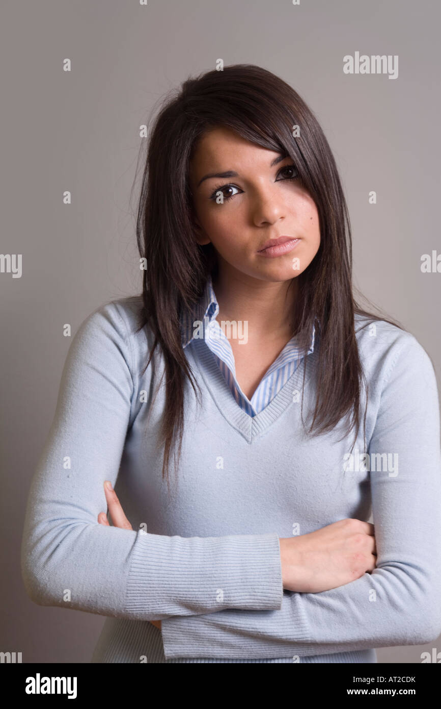 Young student standing with crossed arms waiting for an answer Stock ...