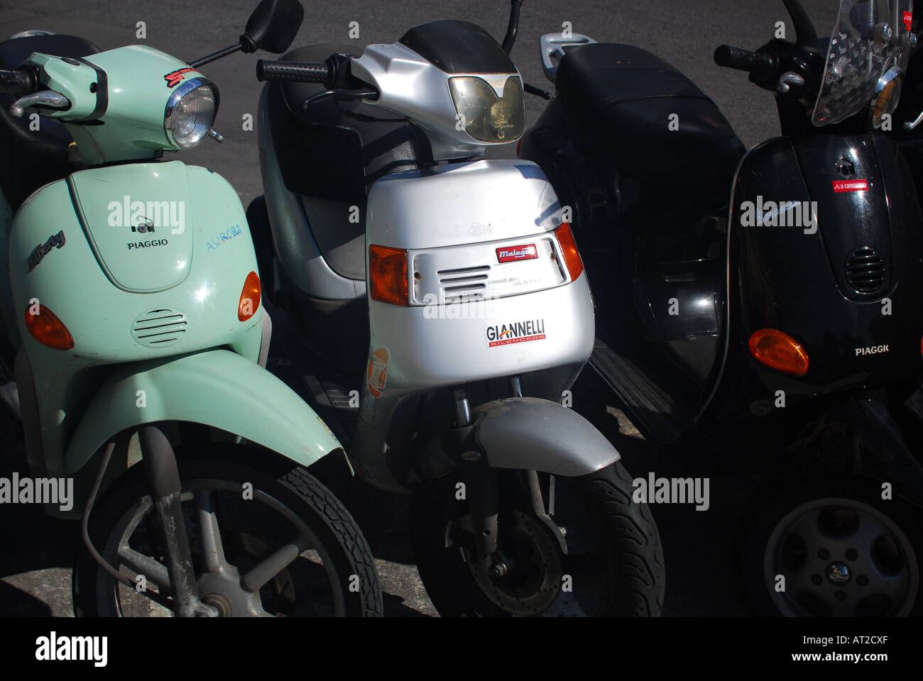 Three mopeds parked next to eachother Stock Photo - Alamy