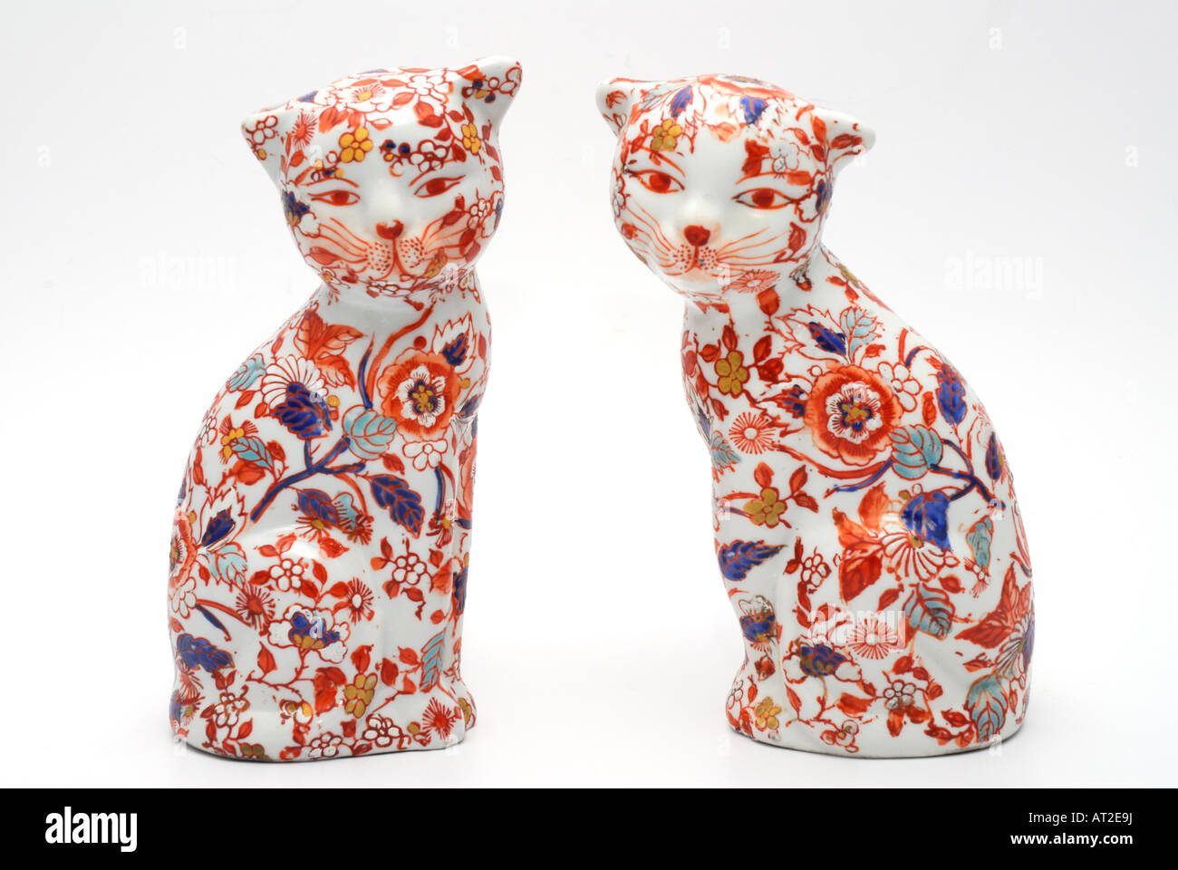 A pair of ceramic antique cats Stock Photo - Alamy
