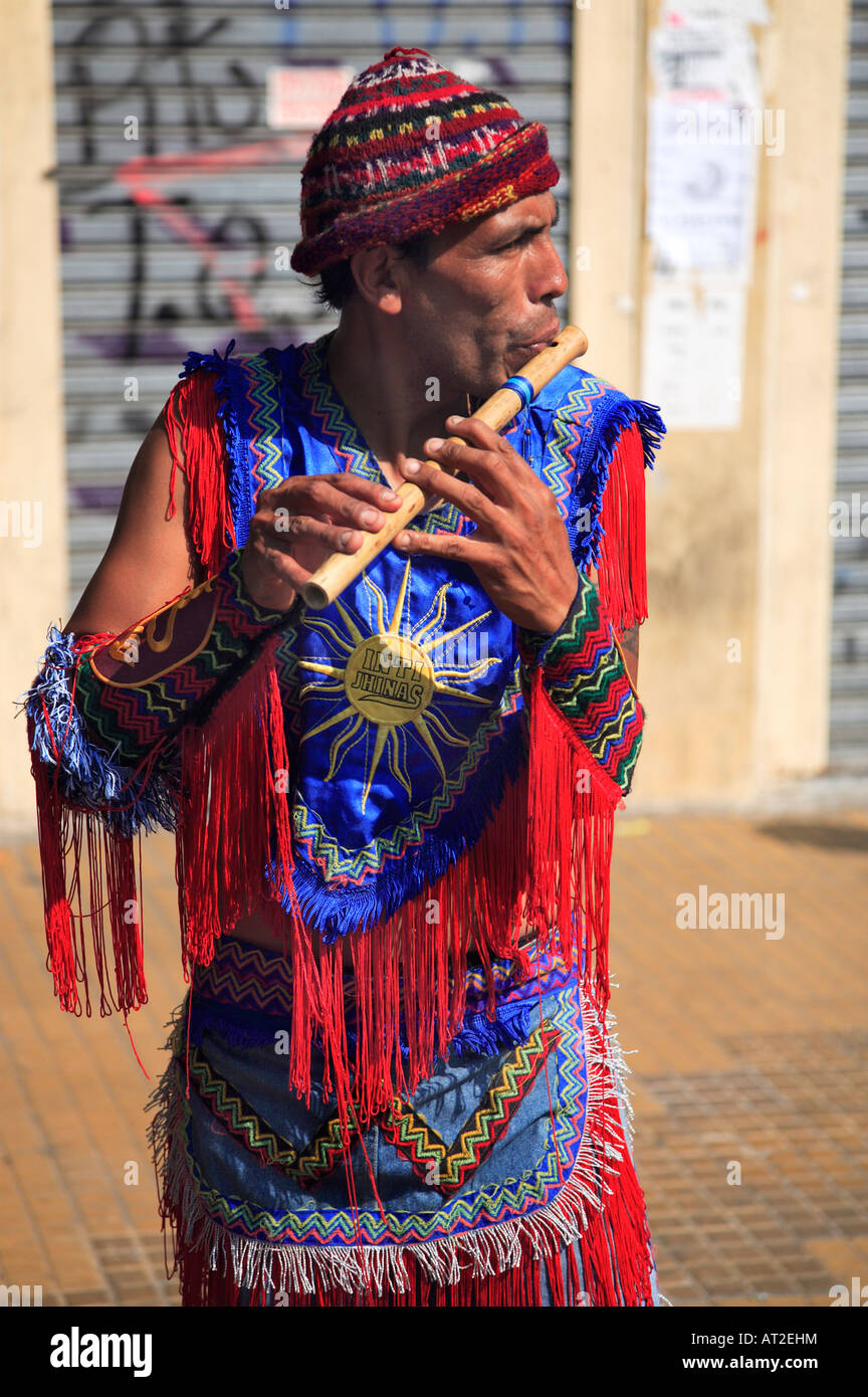 Street folklore musician playing exotic flute in the streets at San ...