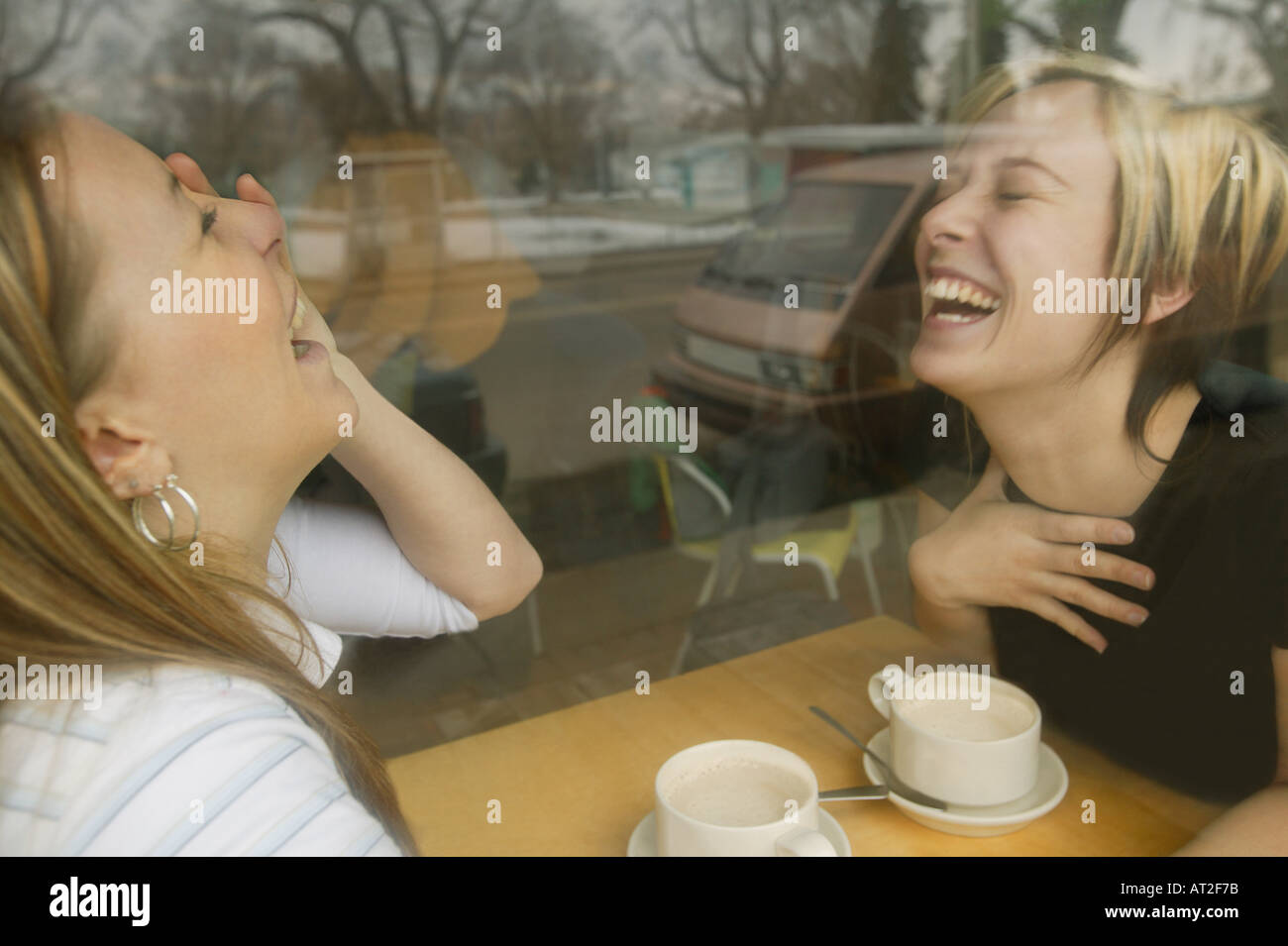 Laugh and giggle fun happy friend share hi-res stock photography and ...