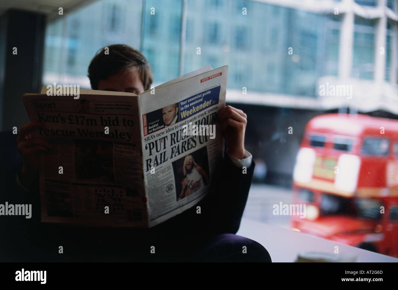 A man reading a newspaper Stock Photo - Alamy
