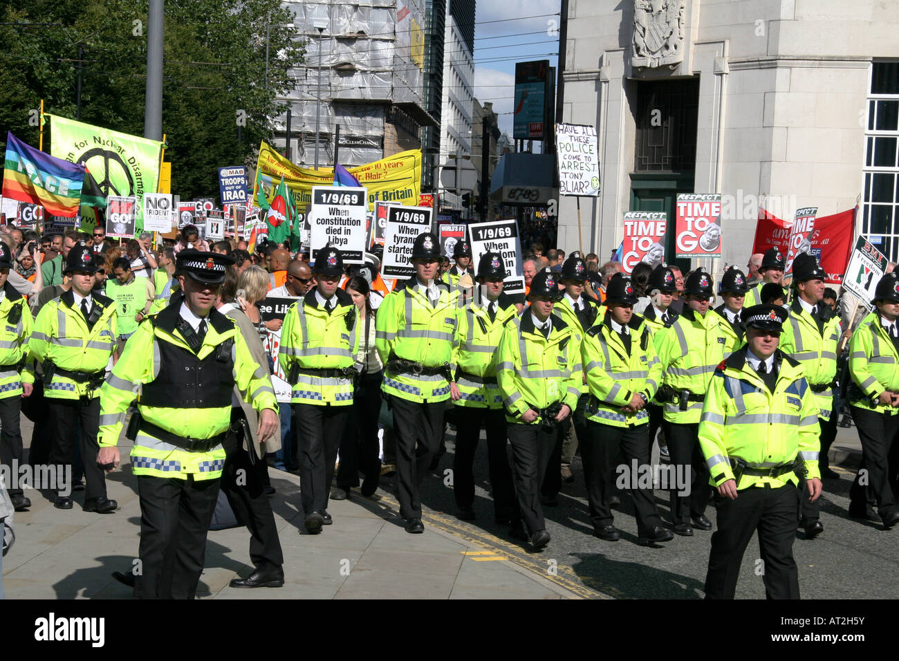 A line of Police head the front of the protest rally during the labour ...