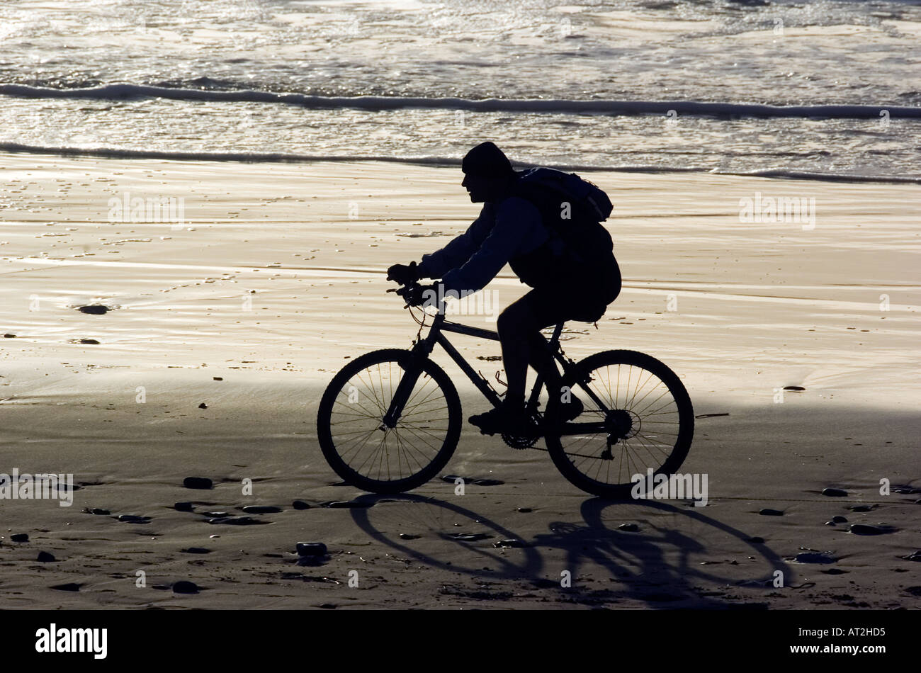 Riding across Llangennith beach on the Gower Peninsular, South Wales ...