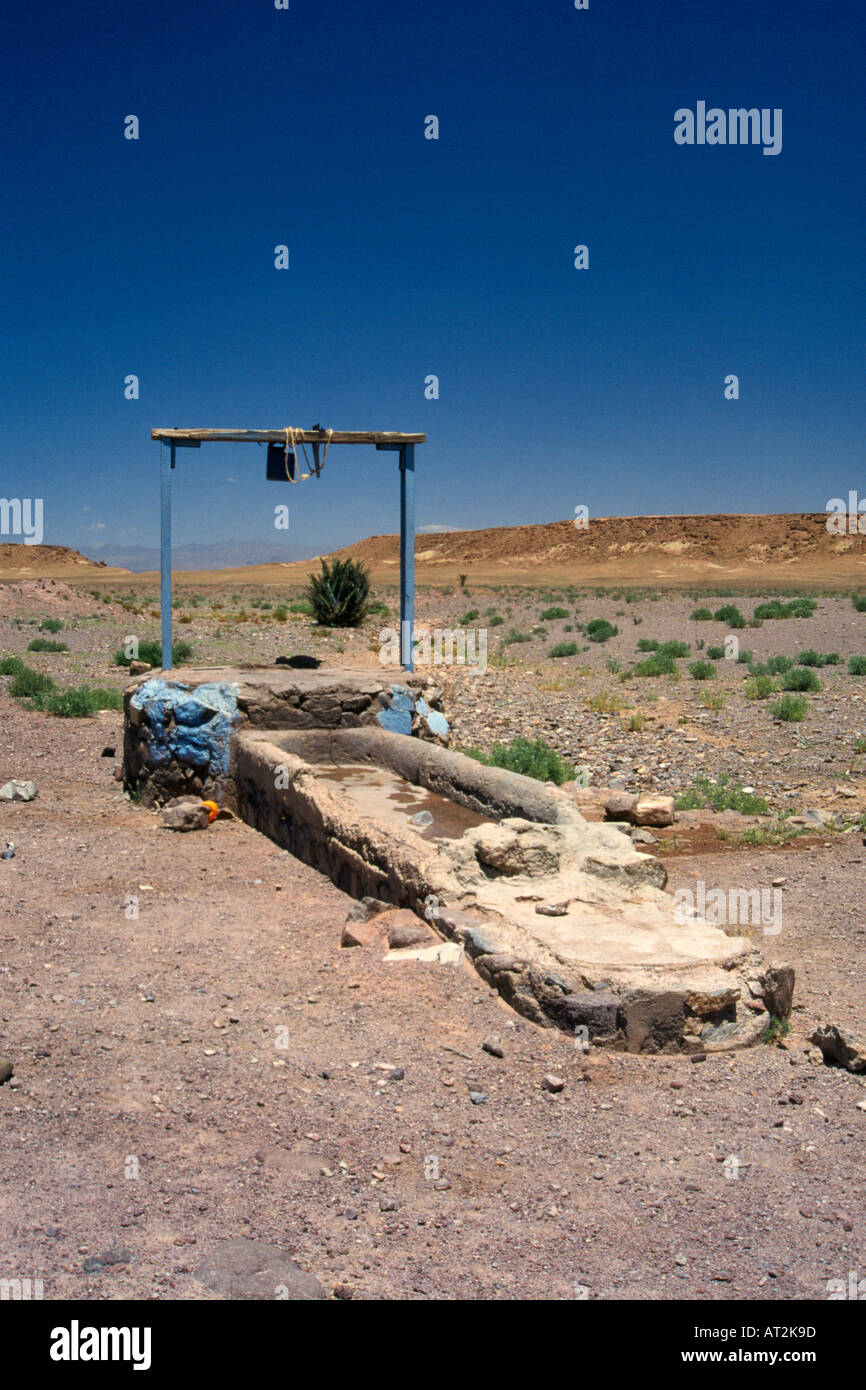 Water well in remote arid stony desert region near historic Ait ...