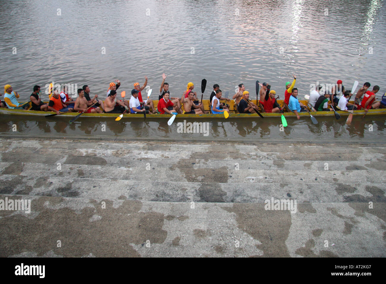 A Dragon boat crew training on the river, Sungai Sarawak, in Kuching ...