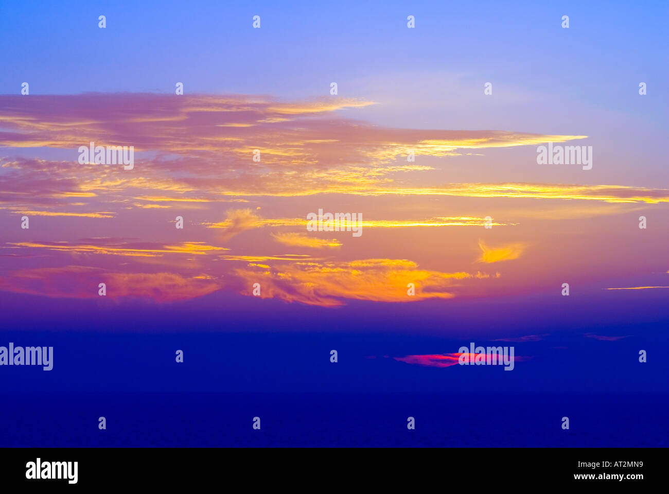 sunset view from menorca as the sun goes down behind majorca Stock ...