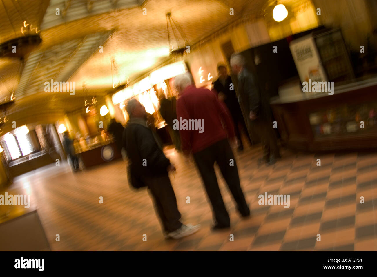 Two men talking in the hallway of an office building Stock Photo - Alamy