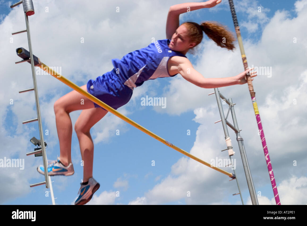 High School Girl Attempting A Pole Vault In A Track And Field Meet