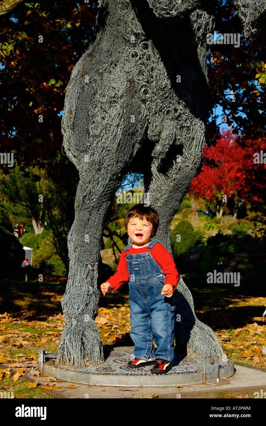 Small boy enjoying the fall apple festival at the UBC botanical gardens ...