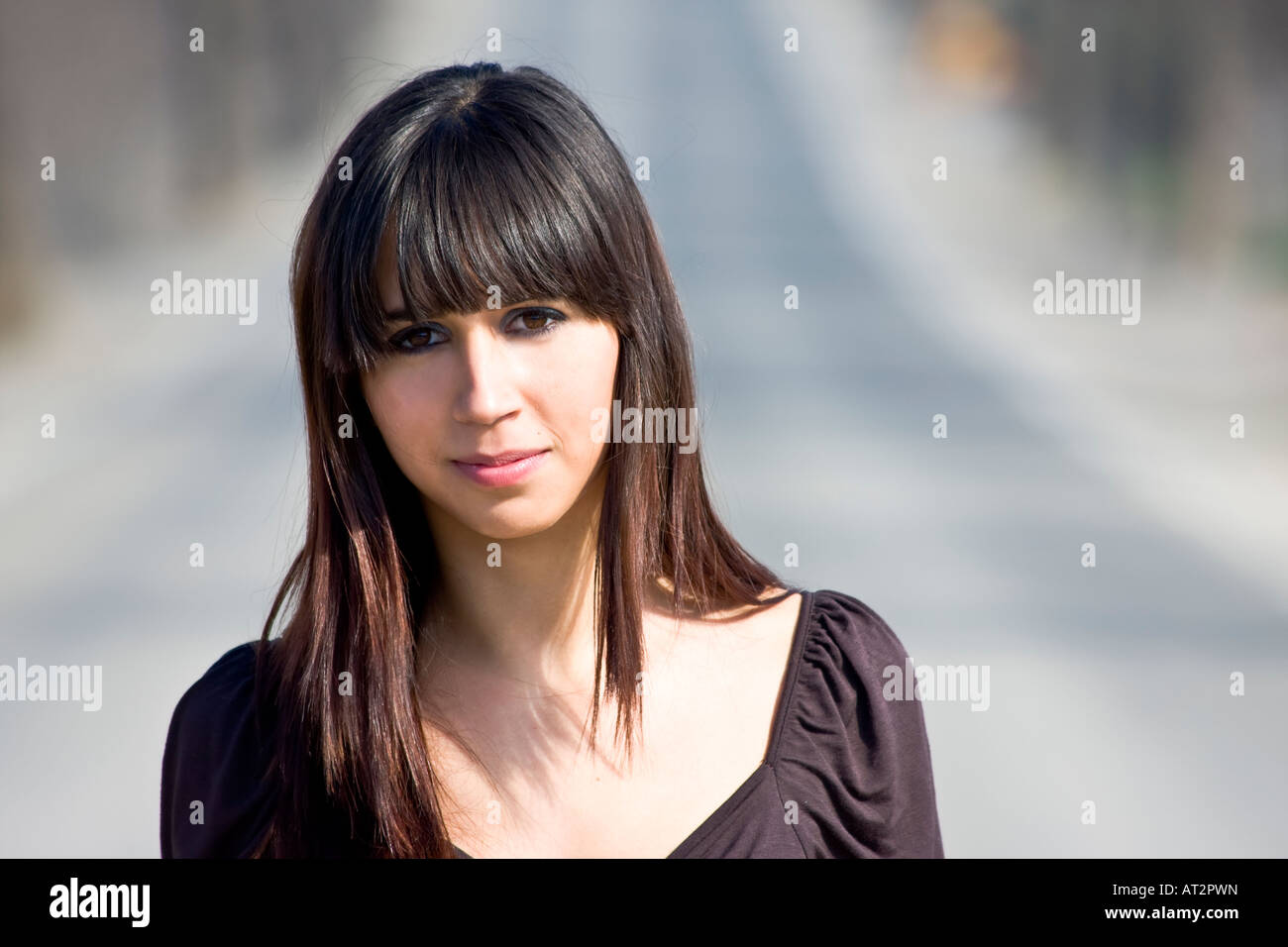 Candid portrait against road background Stock Photo - Alamy