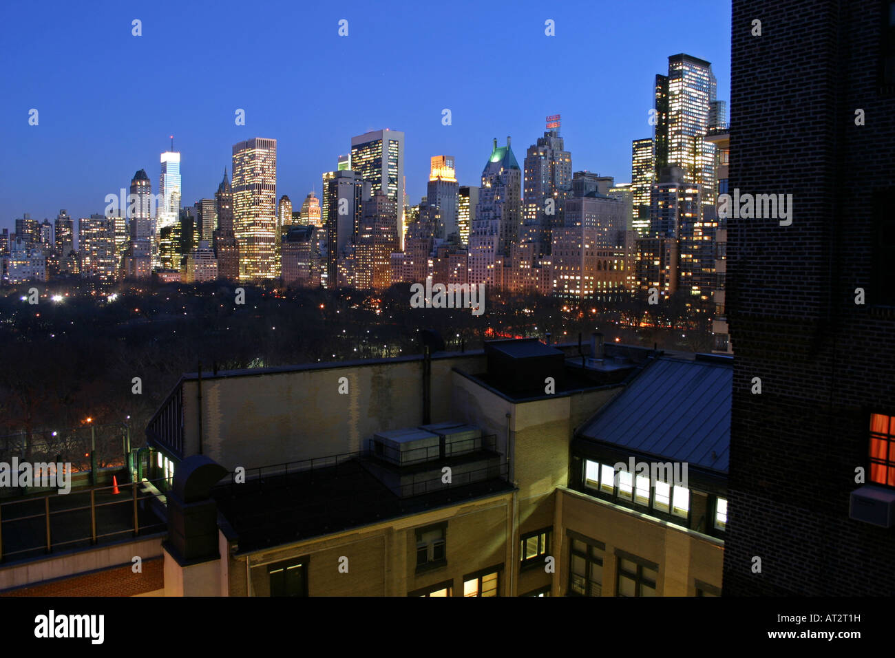 A nighttime view with roof tops and skyscrapers on the southern edge of ...