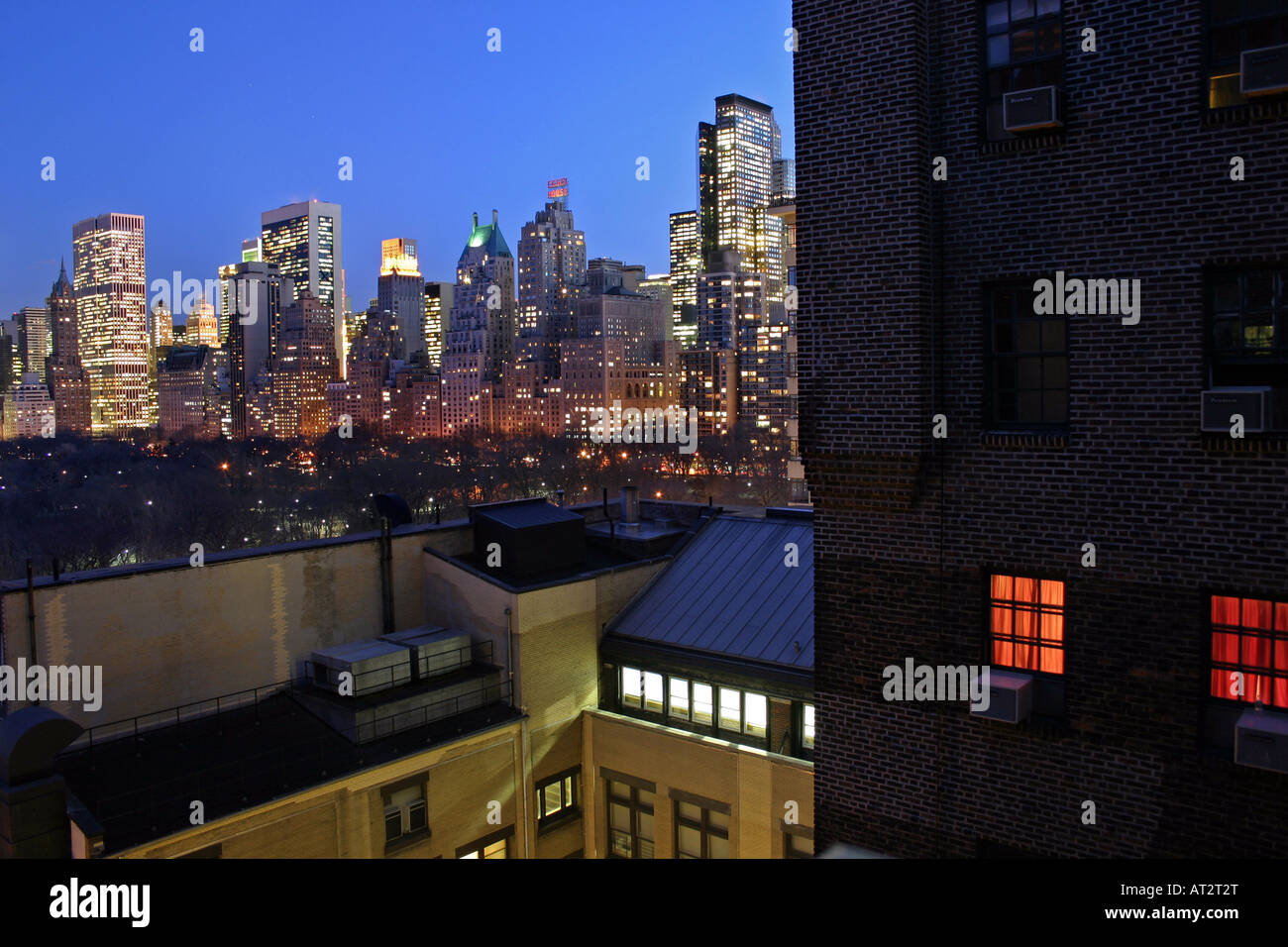 A nighttime view with roof tops and skyscrapers on the southern edge of ...
