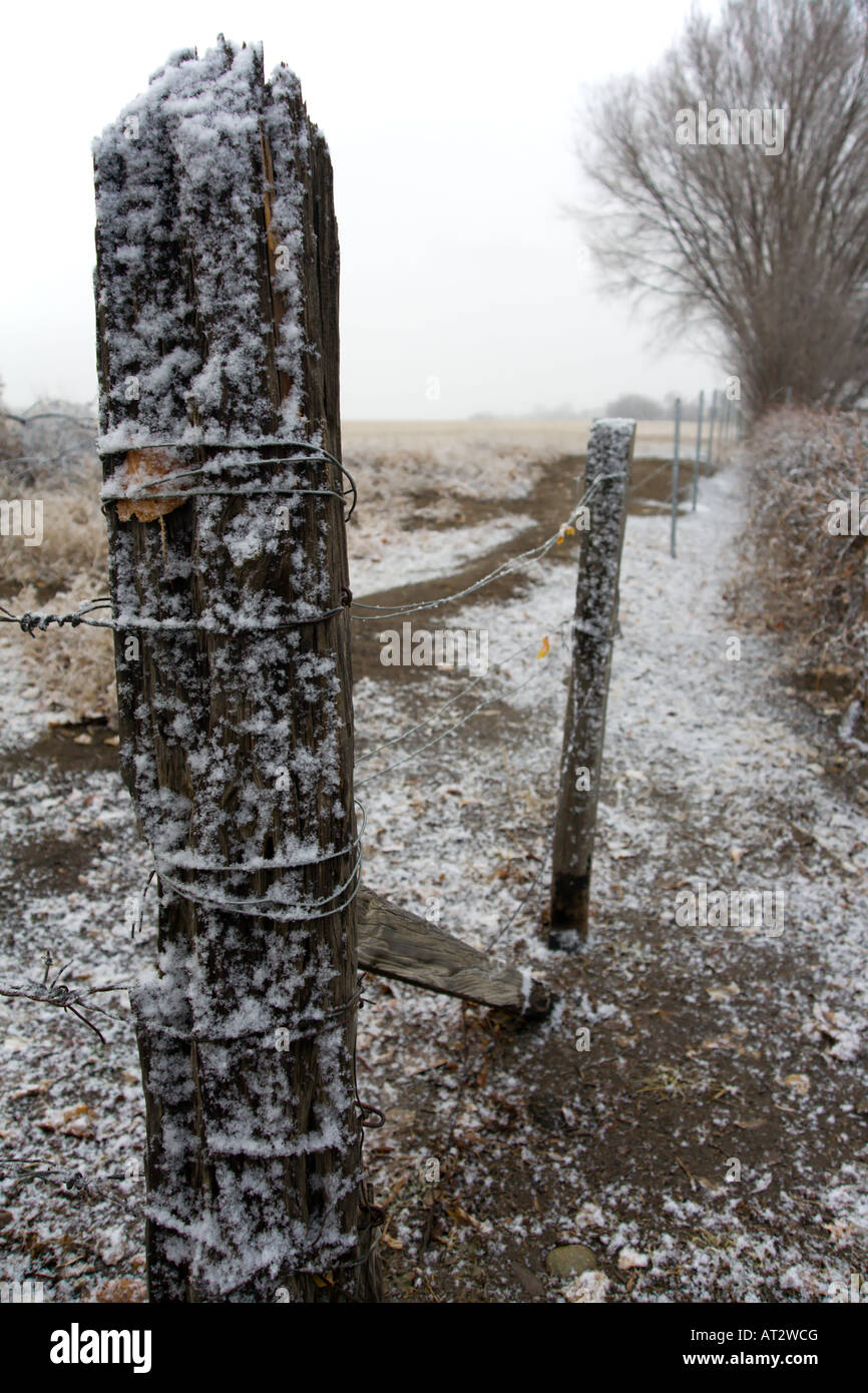 Post showing snow blown on one side Stock Photo - Alamy