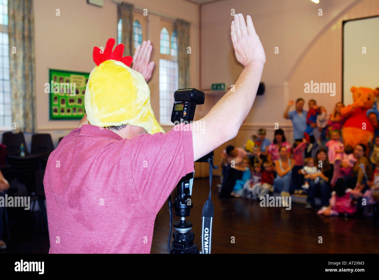 Photographer in chickens head mask Stock Photo - Alamy