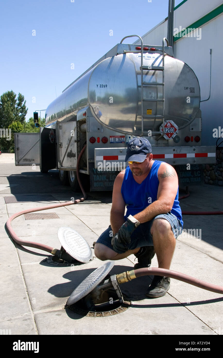 Man delivering fuel at petrol station hi-res stock photography and ...