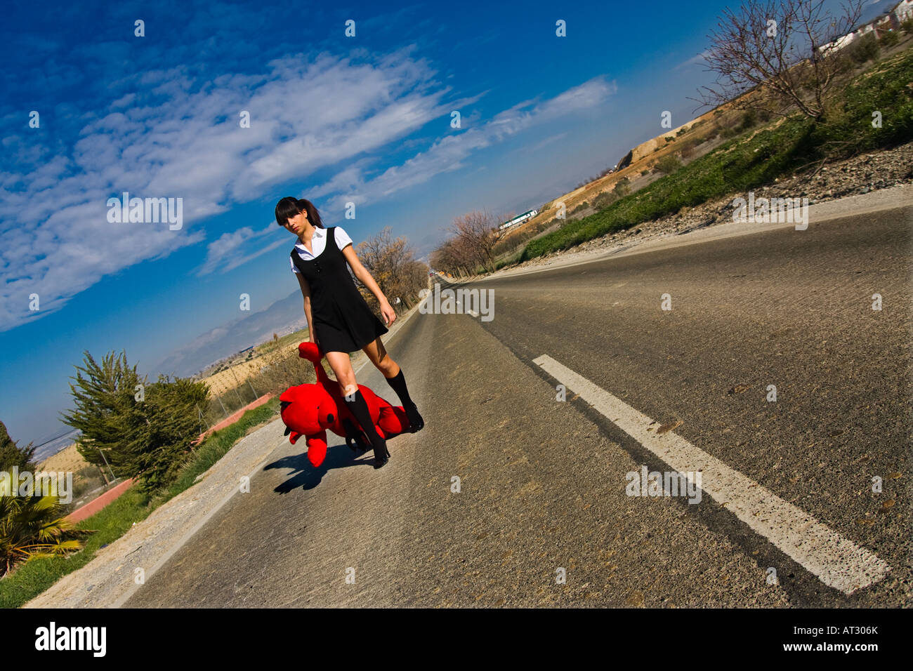 Young girl left behind with her teddy bear Stock Photo - Alamy