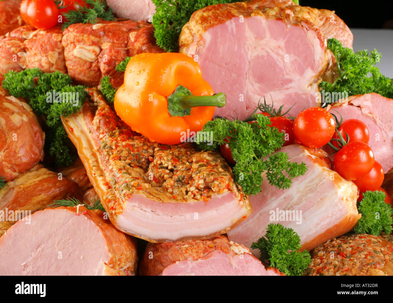 Joints of ham with a vegetables Stock Photo - Alamy