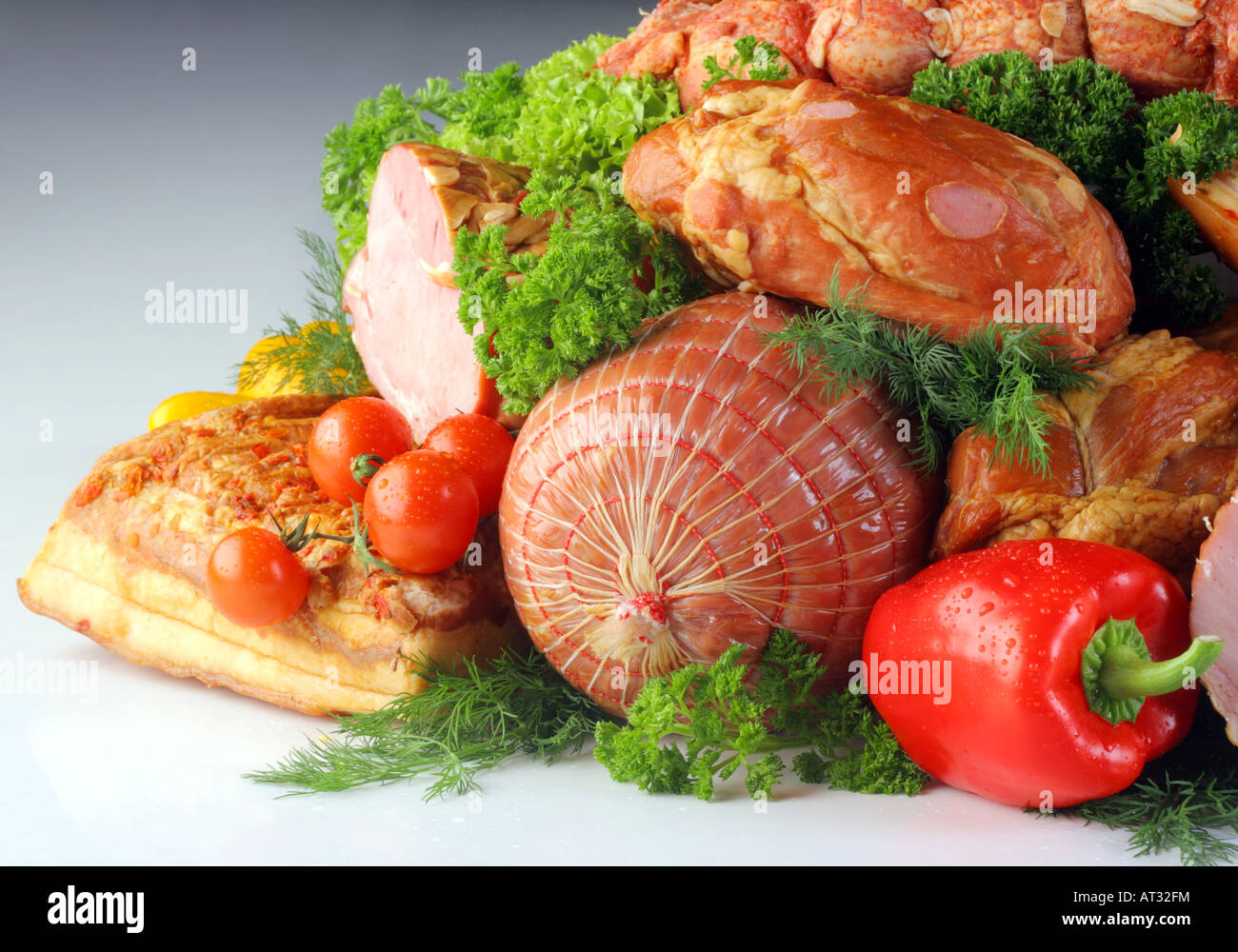 Joints of ham with a vegetables Stock Photo - Alamy