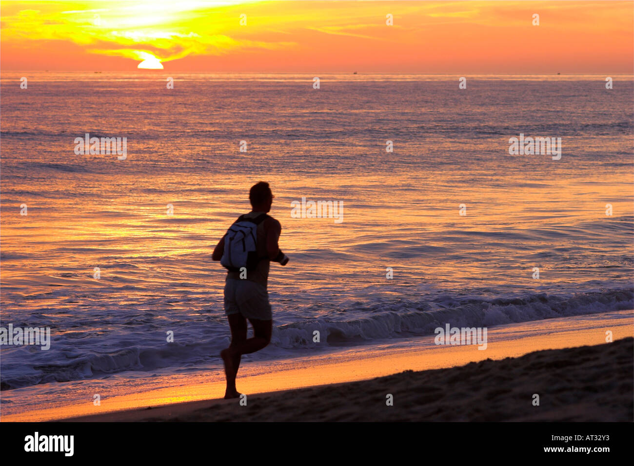 Jogging at lonely beach hi-res stock photography and images - Alamy