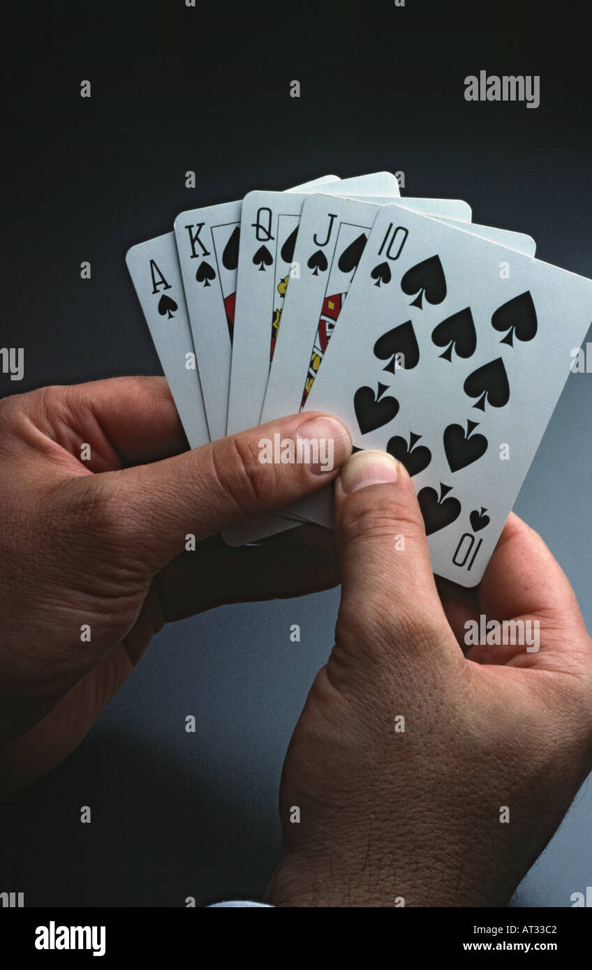 Poker hand showing royal flush Stock Photo - Alamy