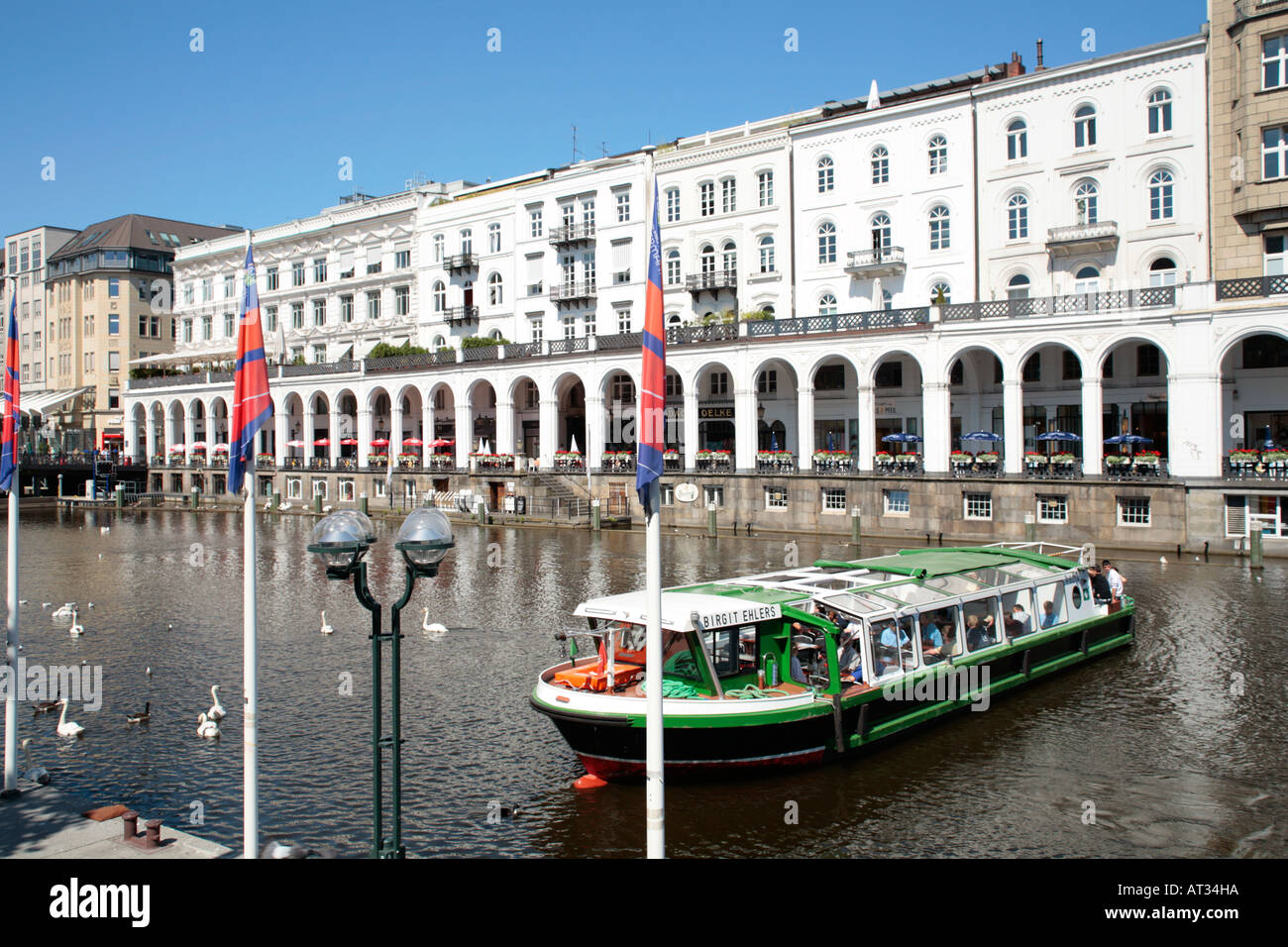 a passenger ship on Alsterfleet in front of the Alster Arcades in ...