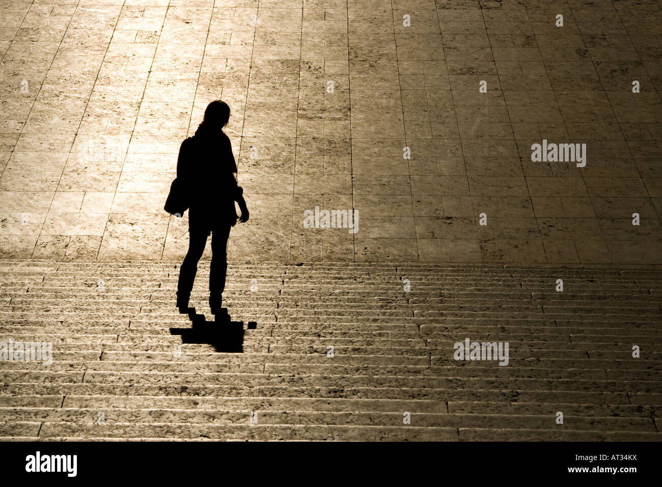 Girl walking up steps Stock Photo - Alamy