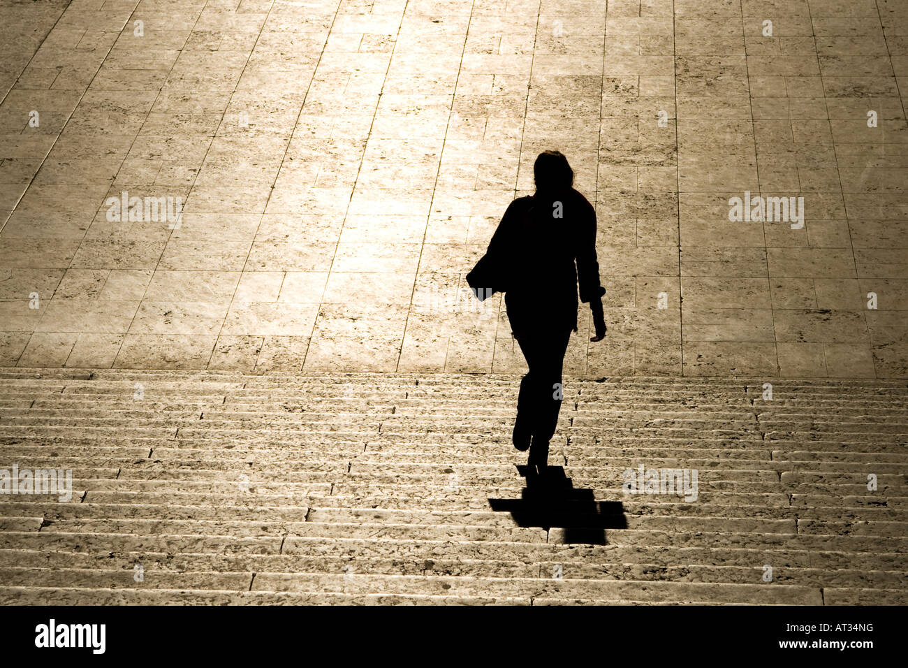 Girl walking up steps Stock Photo - Alamy