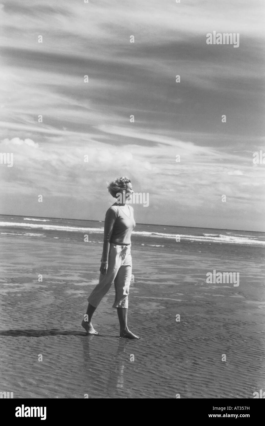 Walking along the beach Black and White Stock Photos & Images - Alamy