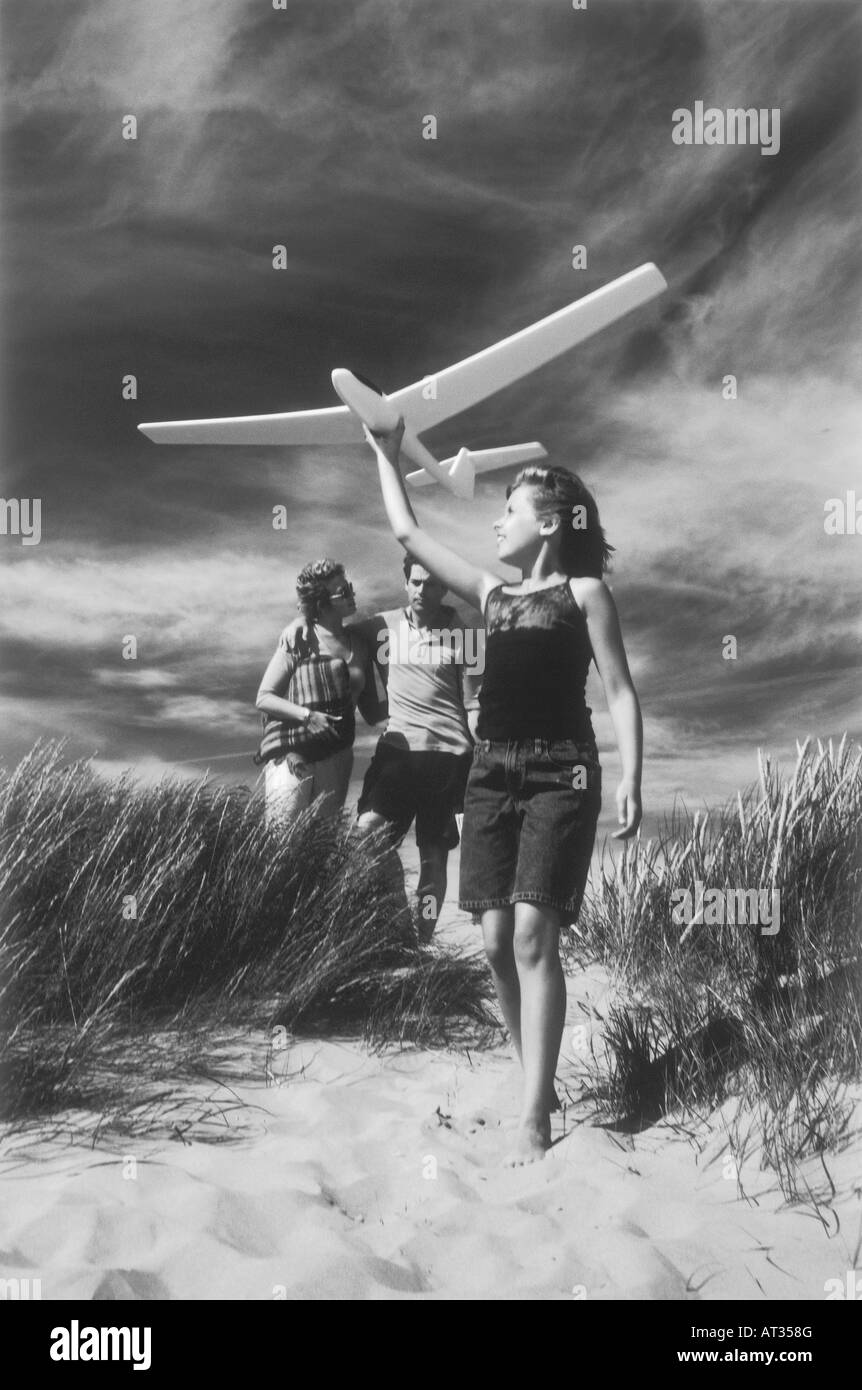 A girl holding a model airplane Stock Photo - Alamy