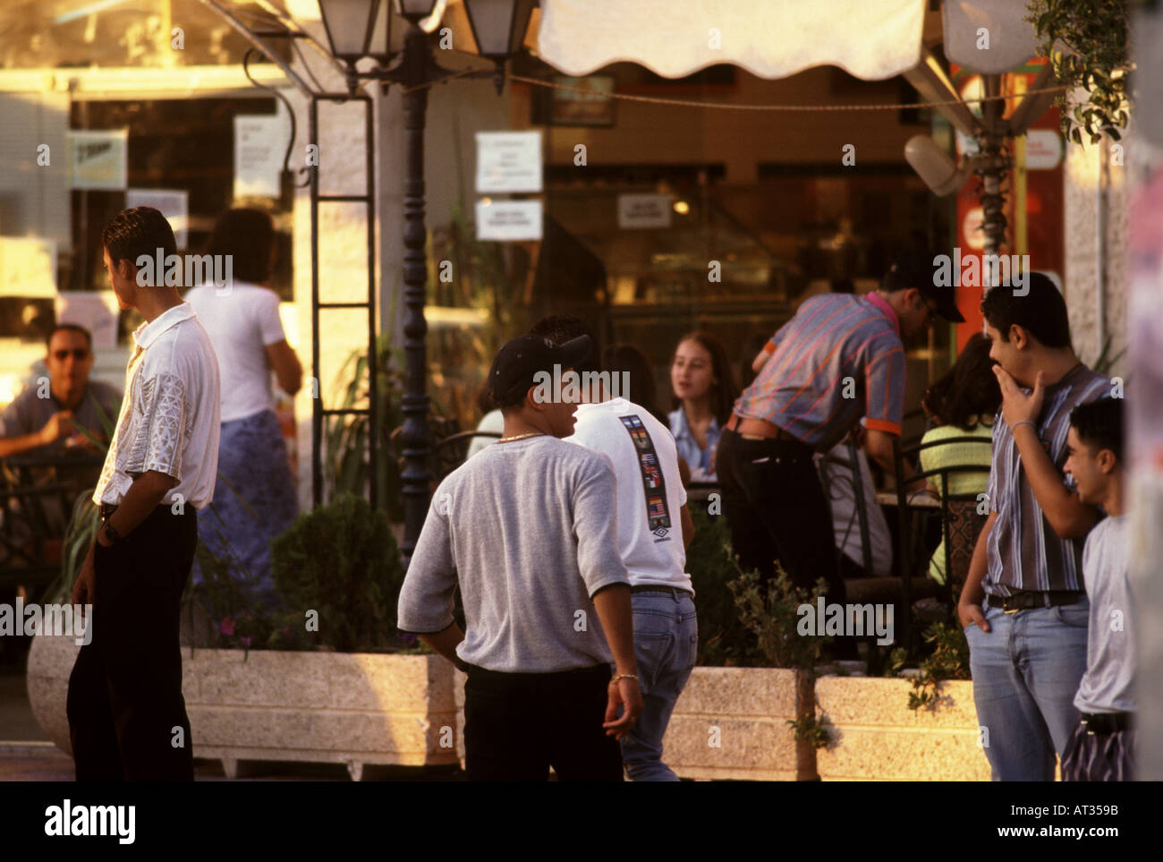 Young Jordanian men loitering around outdoor restaurants in the ...