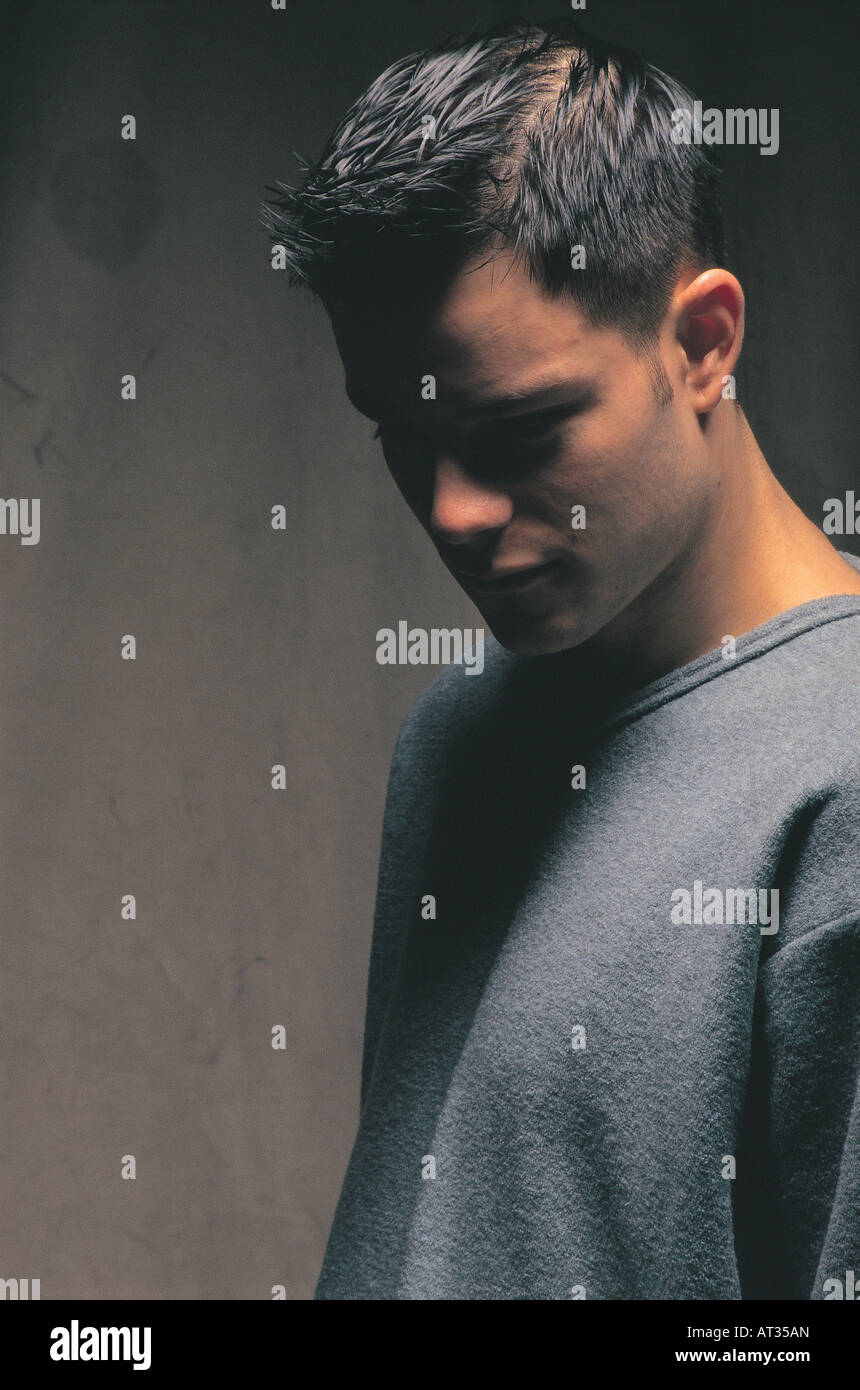 A portrait of a young man, looking down Stock Photo - Alamy