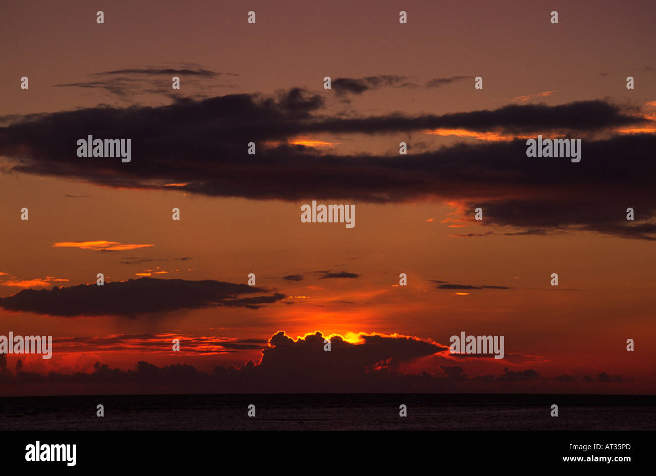 Sunset behind clouds in the Maldives, Indian Ocean Stock Photo - Alamy